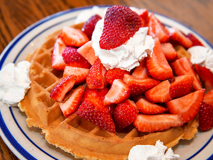 A waffle that's dressed for success with fresh strawberries and whipped cream. Breakfast or dessert? The line deliciously blurs.