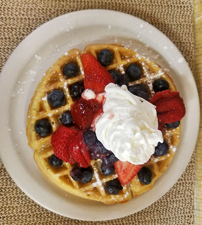 Berry-studded waffle perfection that makes you wonder why anyone would ever choose a sad hotel breakfast buffet over this cloud of golden deliciousness.