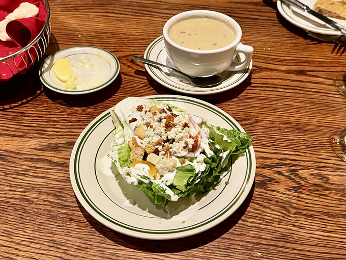 The wedge salad&mdash;that beautiful dinosaur of steakhouse appetizers&mdash;stands proud with blue cheese crumbles playing hide and seek among the greens.
