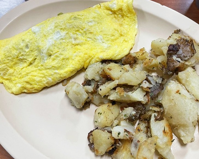 A Western omelet stuffed with more goodies than a cowboy's saddlebag, folded with engineering precision and love.