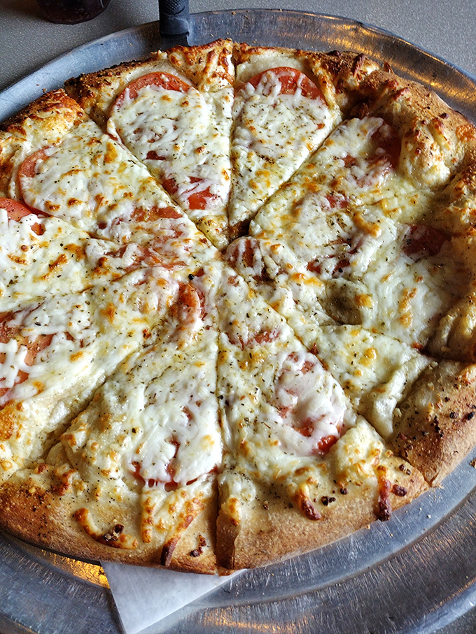 A white pizza that proves sometimes the best conversations happen when tomato sauce politely excuses itself from the party.