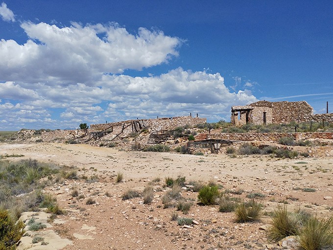 Stone foundations whisper tales of roadside attractions that once made families stop and wonder in amazement.