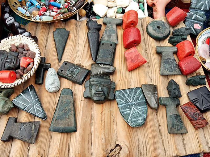 Ancient faces carved in stone stare back from another time. Someone's archaeological treasures become another's perfect bookshelf conversation starter.