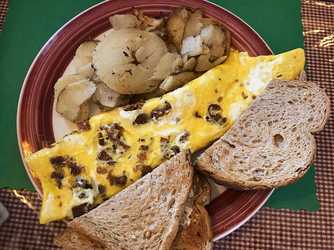 A bacon and cheese omelet so fluffy it practically floats off the plate.