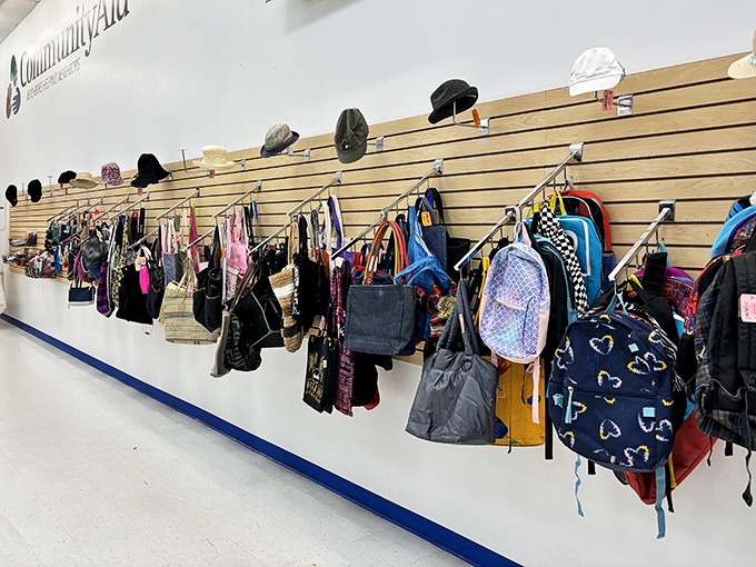 The wall of hats and bags tells stories of past adventures. Each backpack once carried someone's essentials; now they're ready for your next journey.