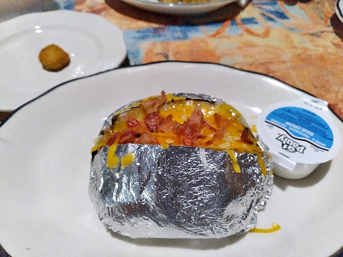 A loaded baked potato that's basically a meal wearing a potato costume, comfort food at its finest.