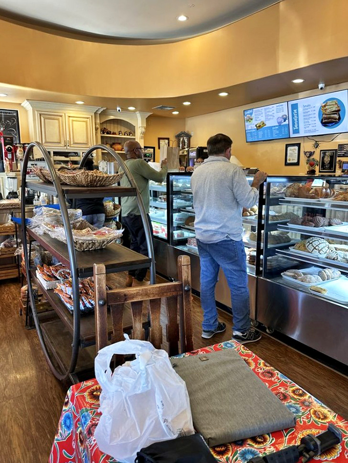 Behind glass, rows of Mexican pastries stand at attention like sweet soldiers ready for duty.