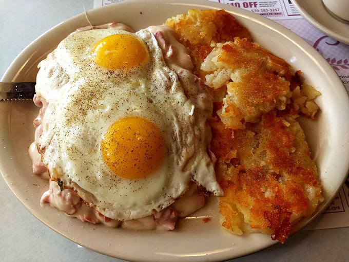 Behold the classic diner breakfast in its natural habitat: sunny-side-up eggs lounging atop creamy chipped beef with golden hash browns standing guard.