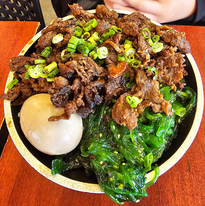 Bulgogi served with a runny egg and greens&mdash;a bowl so photogenic it should have its own agent. Your chopsticks won't know what hit them.