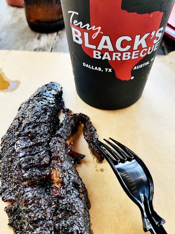 That cup isn't for drinking&mdash;it's holding Terry Black's burnt ends and a beverage that pairs perfectly with meat candy. Barbecue bliss in its purest form.