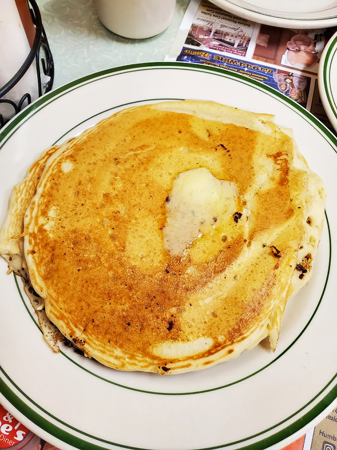The pancake that launched a thousand satisfied sighs. Golden-brown, plate-filling, and just waiting for that first magical butter-melting cut.