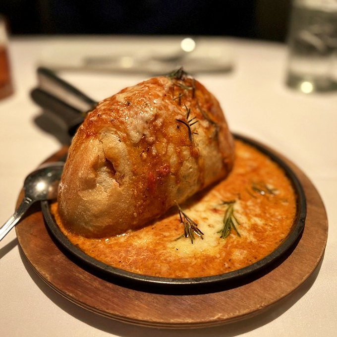 Not just bread&mdash;a souffl&eacute; masquerading as bread, swimming in a pool of creamy sauce that makes you question all other carbohydrates you've ever known.