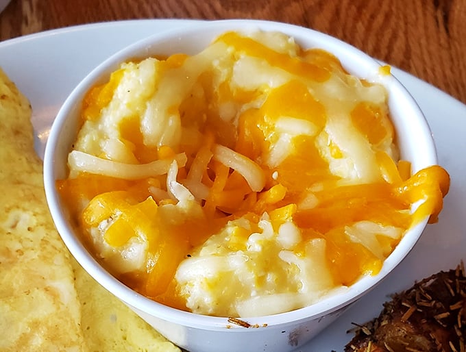 Cheese grits that would make a Southerner weep with joy &ndash; creamy, indulgent, and unapologetically comforting in their little white bowl of happiness.