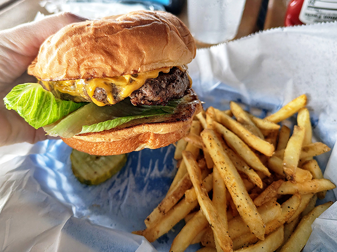 This burger isn't just a meal, it's a compelling argument for taking the rest of the day off. Note the golden fry perfection.