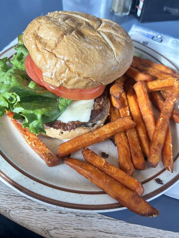 Behold the burger that launched a thousand napkins! Those sweet potato fries aren't sidekicks &ndash; they're co-stars in this lunchtime drama.