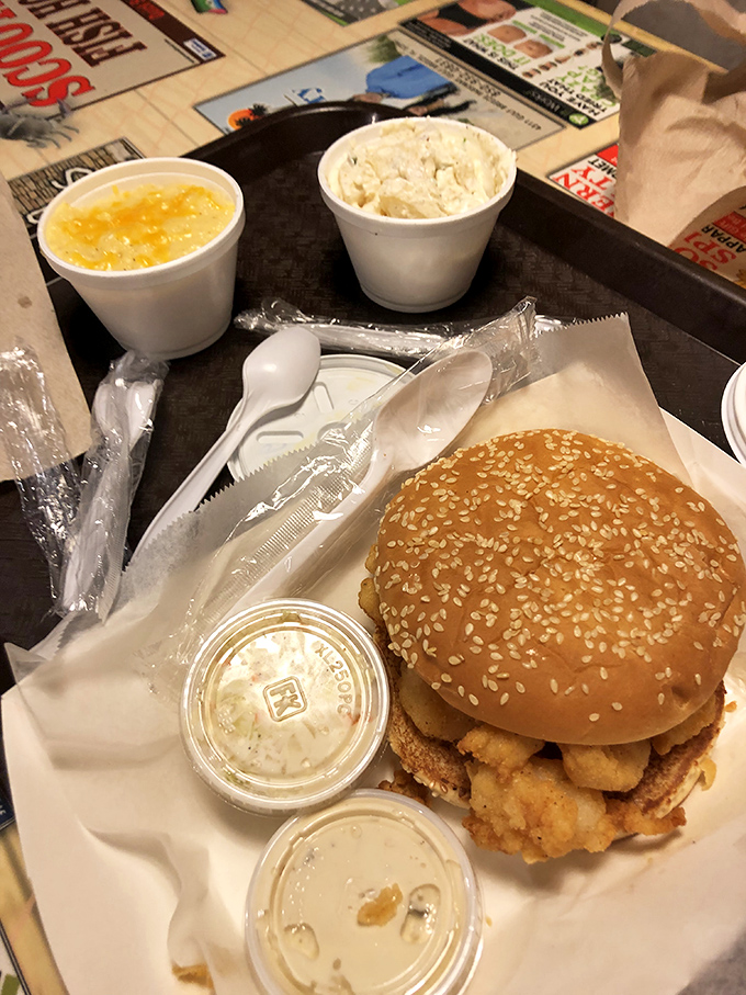 This isn't just a sandwich; it's seafood architecture&mdash;a golden-fried masterpiece nestled in a sesame seed bun with all the fixings.