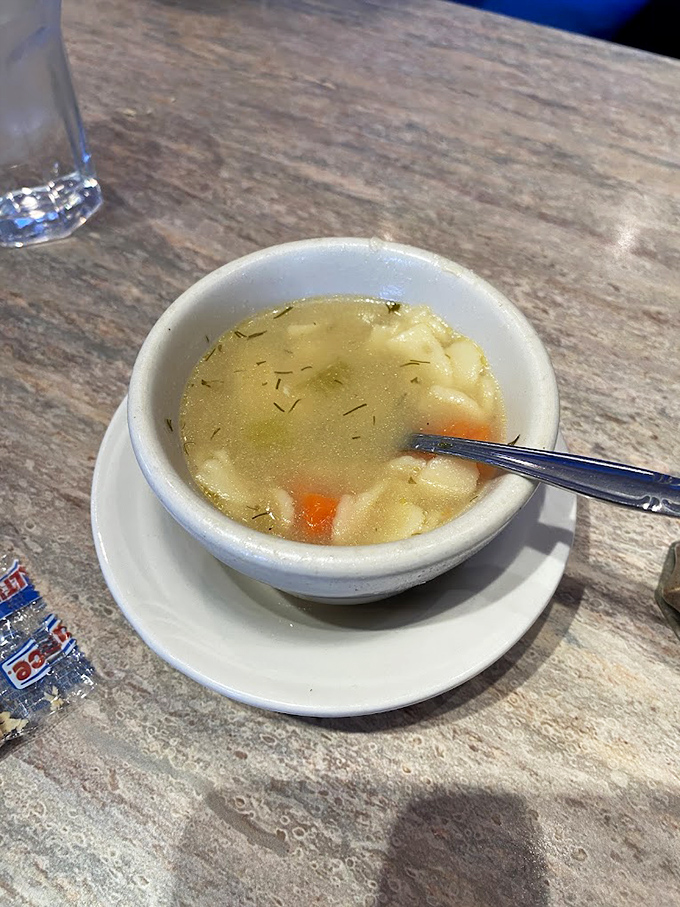 Chicken soup so clear you could read yesterday's Eagles score through it. Comfort in a bowl with perfectly diced vegetables standing at attention.