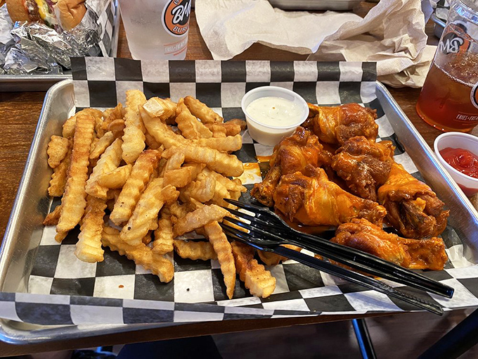 Crispy fries and saucy wings&mdash;the dynamic duo of comfort food. No superhero cape required, just extra napkins.