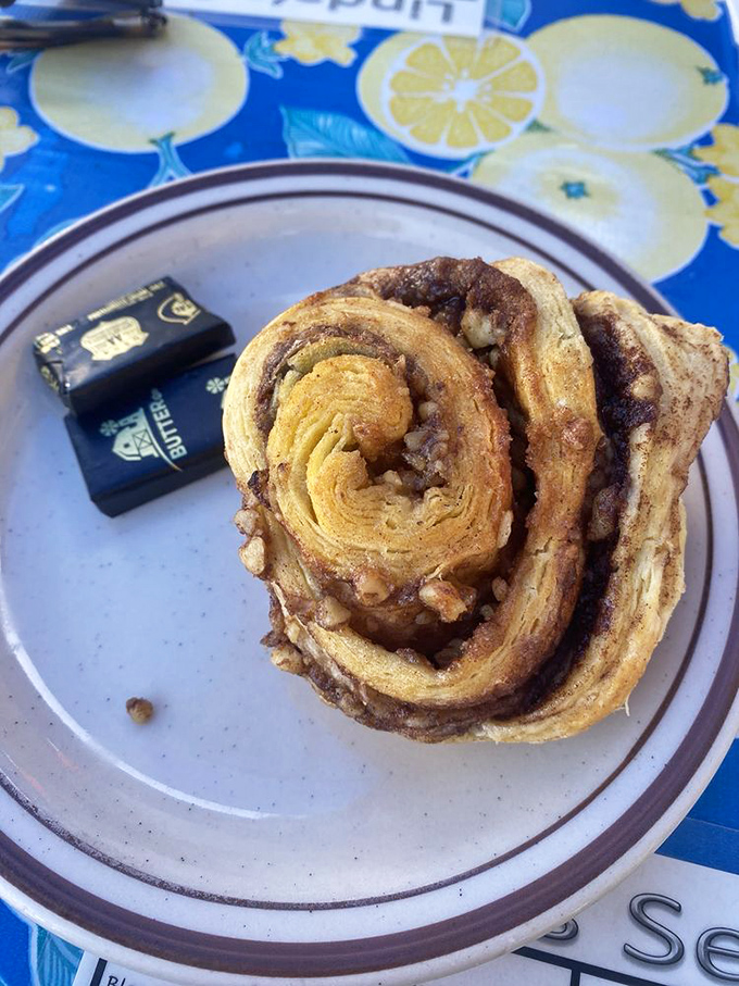 The legendary cinnamon roll in all its spiral glory. Not so much a pastry as it is an architectural achievement of butter, cinnamon, and perfect timing.