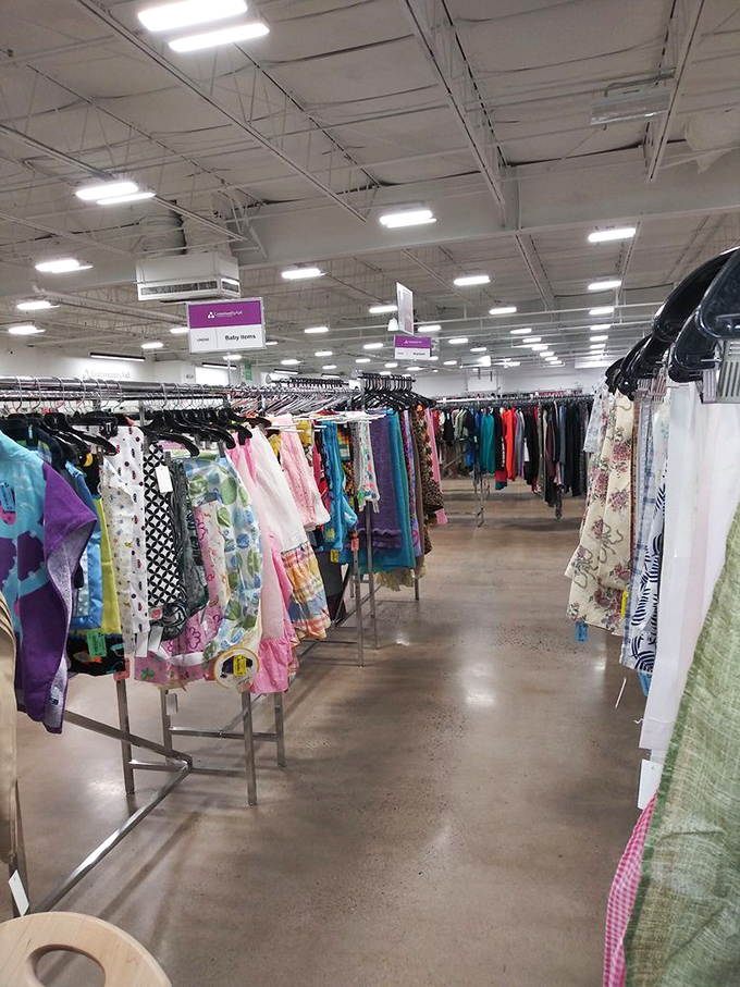 The women's section: a kaleidoscope of colors, patterns, and possibilities. Fashion archaeologists dig through layers of styles spanning decades, searching for buried treasure.