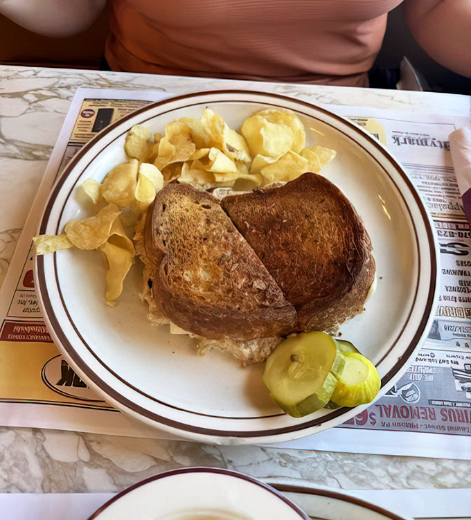 The sandwich that answers the eternal question: "How many delicious layers can you fit between two slices of perfectly toasted bread?"