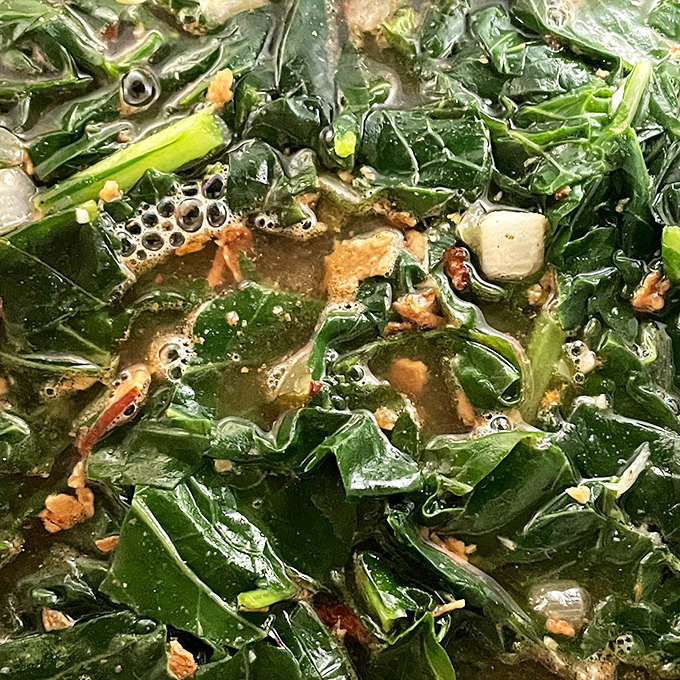 These collard greens swimming in pot liquor tell the whole story of Southern cooking: simple ingredients transformed into something so good you'll want to drink the broth.