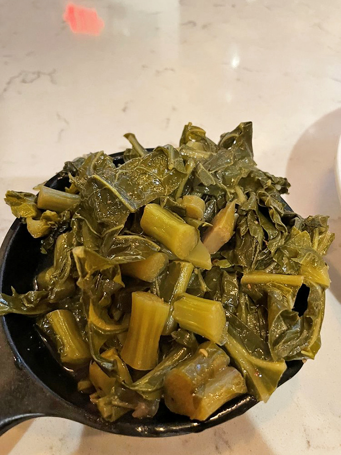 These aren't just collard greens&mdash;they're a Southern tradition simmered to tender perfection, carrying centuries of culinary wisdom in each bite.