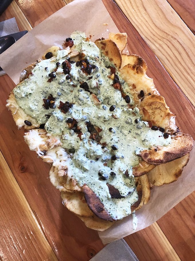 Whoever thought of combining fresh seafood with crispy chips deserves a Nobel Prize in deliciousness &ndash; beach food elevated to an art form.