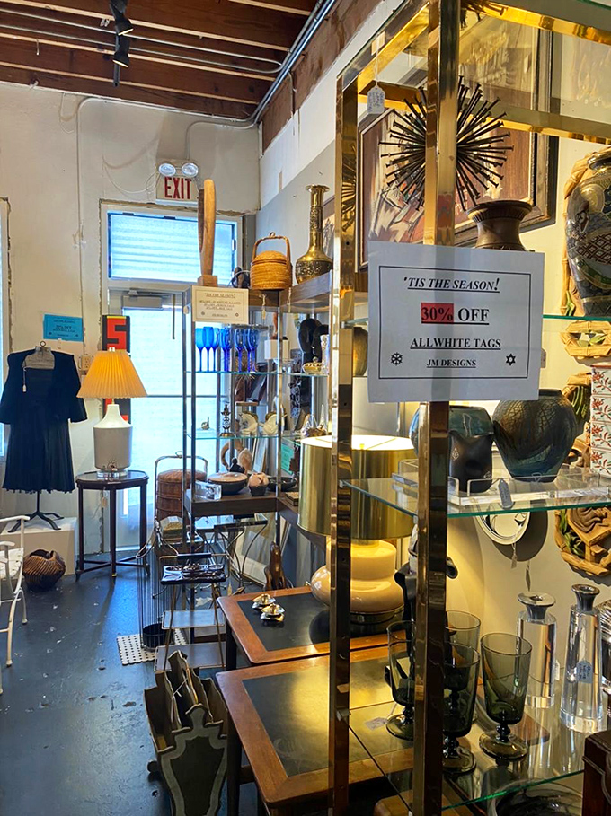 Mid-century modern meets eclectic maximalism in this corner where starburst clocks and brass accents create a designer's playground.