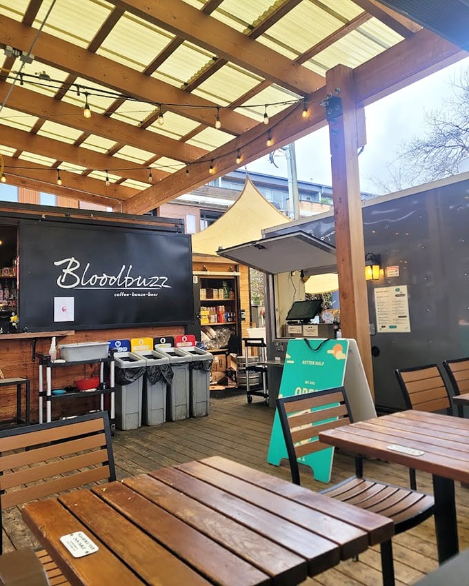 The covered dining area&mdash;where strangers become friends united by the universal language of "mmm" and "pass the sauce."