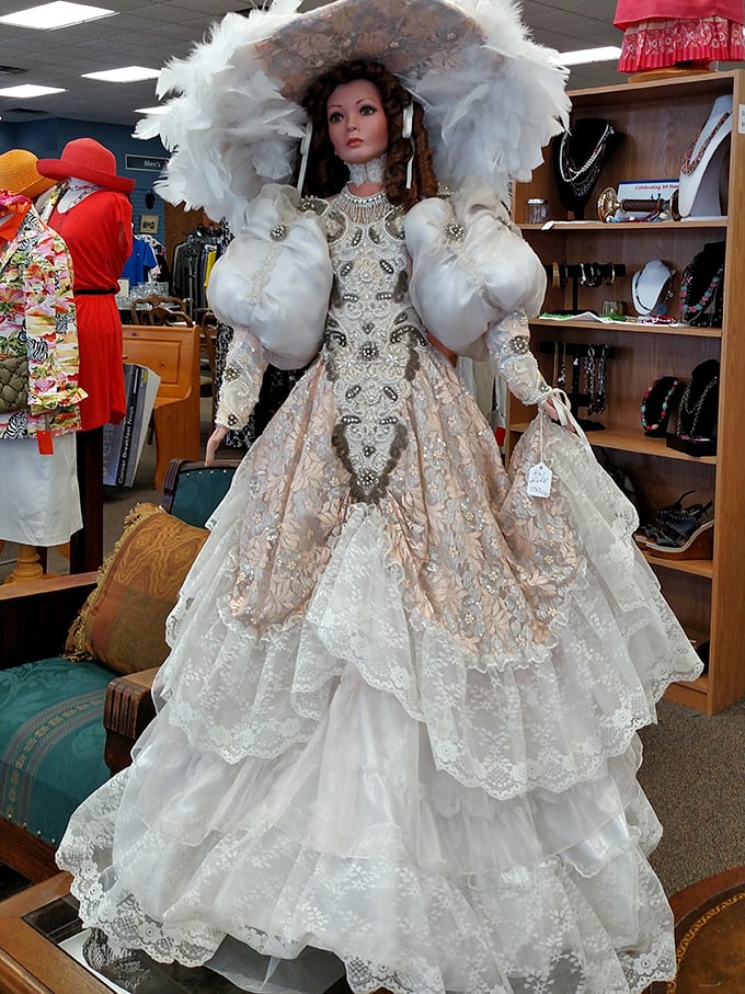 The queen of the thrift store holds court in her feathered finery. Not just a doll, but a conversation-stopping masterpiece of vintage glamour.