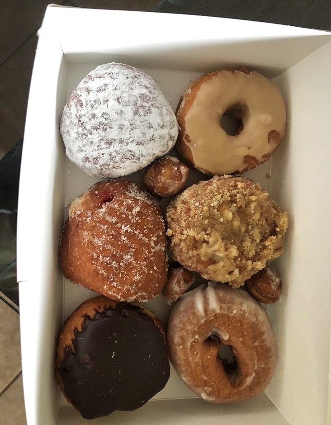 A box of donuts is like a box of possibilities. The chocolate-glazed one is already eyeing me, and I'm not looking away.