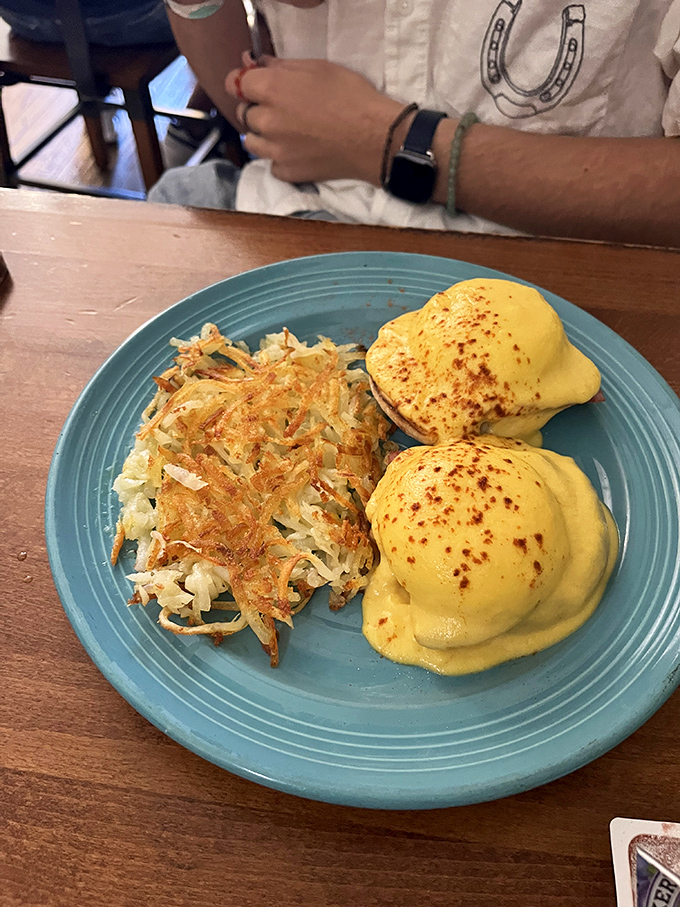 Eggs Benedict that defies gravity with its perfectly poached peaks drowning in hollandaise that could make a grown adult weep with joy.