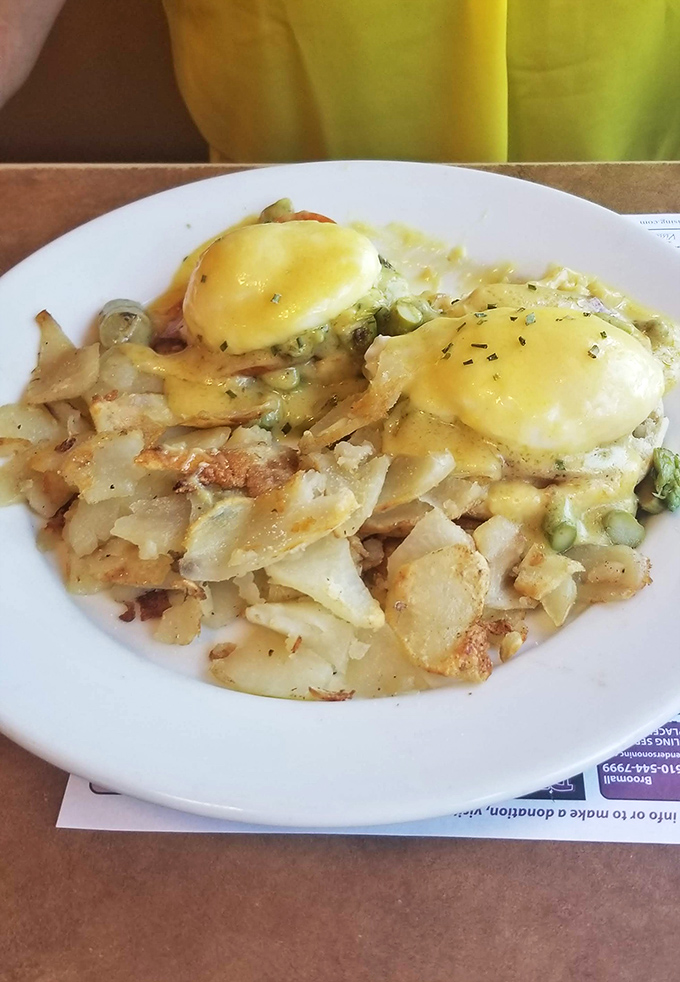 Eggs Benedict that puts hotel brunch buffets to shame. Those home fries have achieved the perfect crisp-to-fluffy ratio &ndash; the golden equation of diner physics.