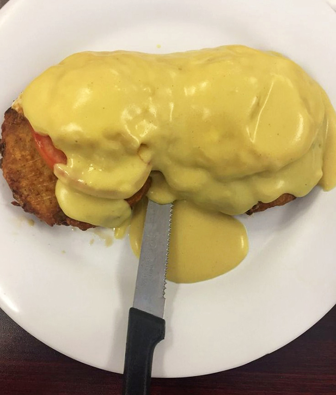 Eggs Benedict drowning in hollandaise isn't just breakfast&mdash;it's a commitment to starting your day with absolutely zero regrets.