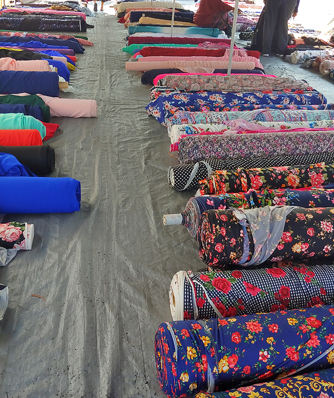 A textile rainbow for the taking. Each roll contains possibilities—curtains, dresses, quilts—limited only by imagination and basic sewing skills.