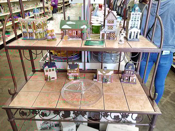 A miniature village awaits adoption. These decorative houses have seen Christmas seasons come and go, ready for a new mantelpiece to call home.