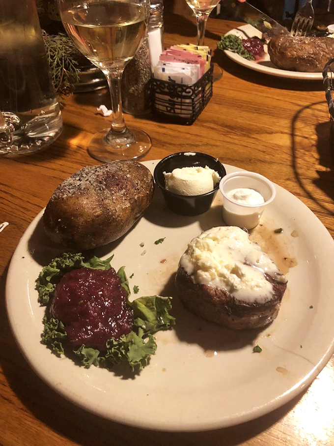 Filet mignon topped with a cloud of butter, paired with a baked potato. Simple perfection that needs no elaborate explanation.