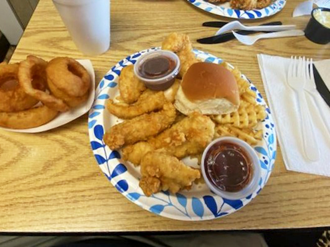 Crispy fish and tender chicken tenders sharing a plate like old friends, with those waffle fries playing the perfect supporting role.