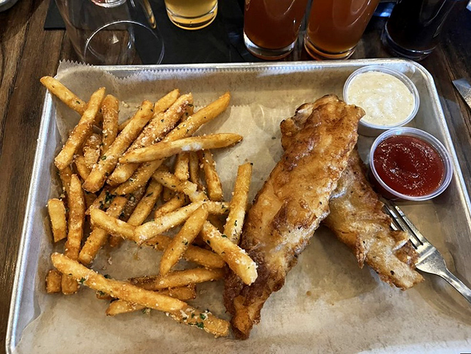 The star of our show: beer-battered fish with a golden crunch that would make King Midas jealous. Those parmesan fries aren't just sides&mdash;they're co-headliners.