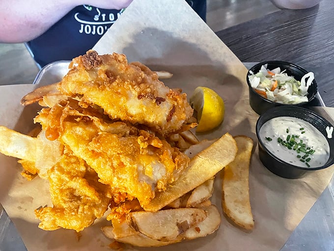Fish and chips that would make a British pub proud. The batter shatters with that perfect crackling sound that's music to a food lover's ears.