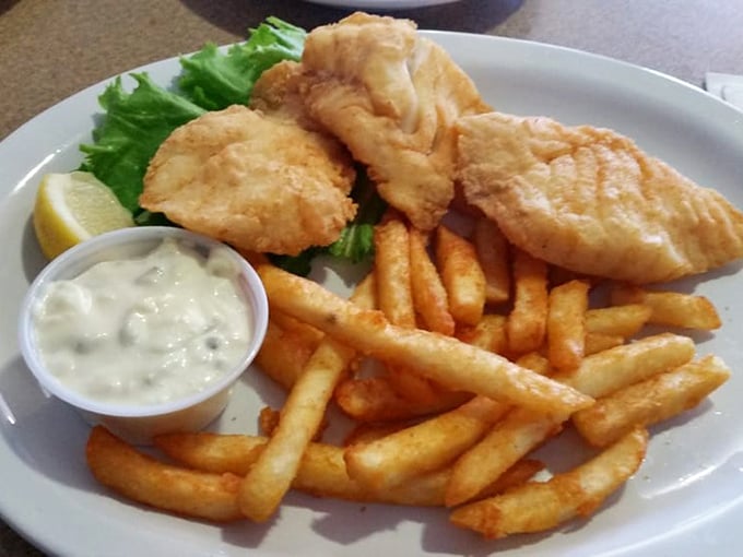 Fish and chips done right: crispy armor protecting tender, flaky treasures from the deep blue.