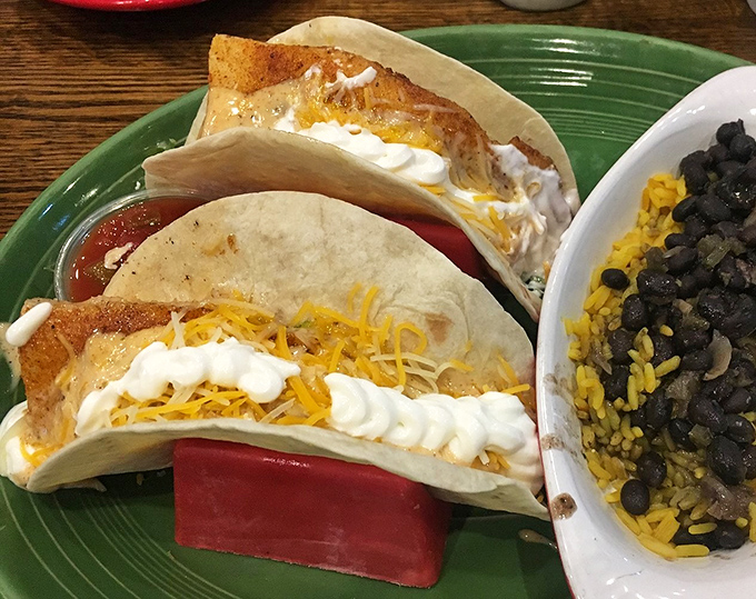 Fish tacos: where the beach meets your taste buds. Crispy fish, melty cheese, and fresh toppings create the perfect handheld vacation for your mouth. 