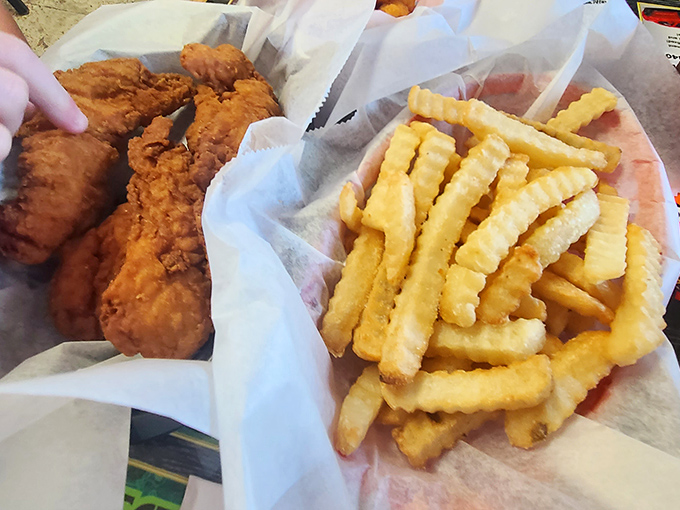 The golden ratio: perfectly crisp chicken meets crinkle-cut fries. Simple food done right is still the best magic trick in the culinary world.