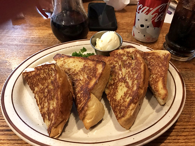 French toast that makes you question all other French toast. Golden, crispy exterior giving way to a custardy center &ndash; breakfast alchemy at its finest.