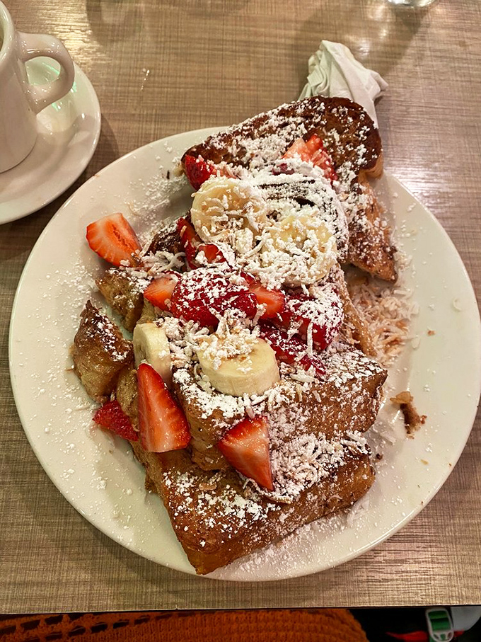 French toast that makes ordinary bread feel inadequate. Those fresh strawberries and bananas are trying to make this indulgence seem healthy&mdash;don't be fooled.