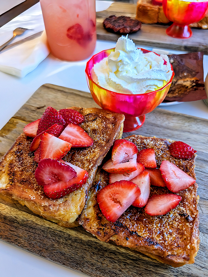 French toast that's had a glow-up. Those strawberries aren't just garnish; they're little red jewels in this breakfast crown.