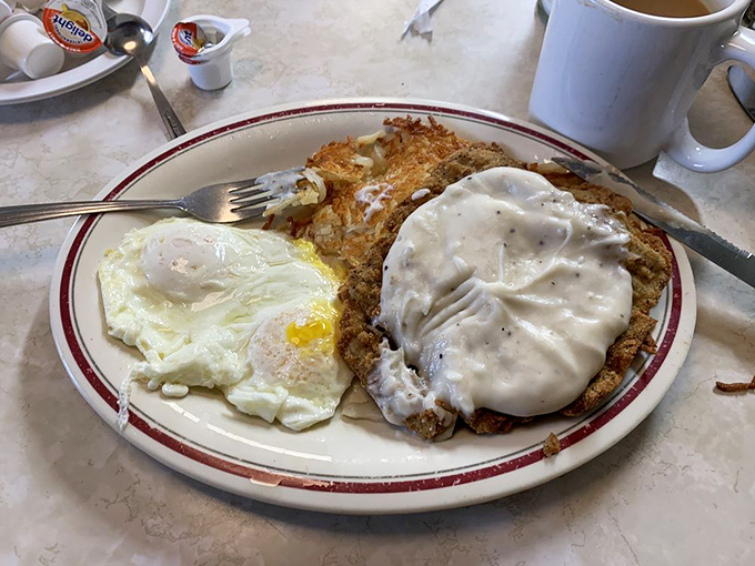 Country fried steak with gravy and eggs&mdash;the breakfast equivalent of a warm hug from someone who really means it.