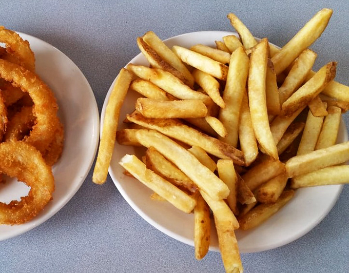 Golden, crispy fries and onion rings that crunch loud enough to drown out your "I'll just have one more" promises.