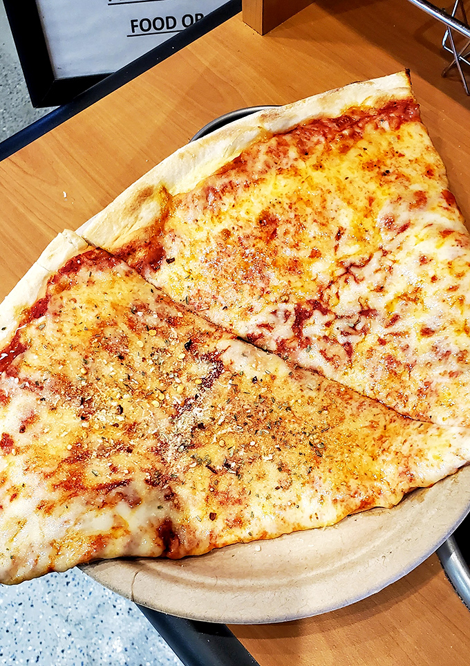 When your pizza slice is bigger than your face, you know you're in the right place. Fold it New York-style or tackle it with utensils&mdash;no judgment here.